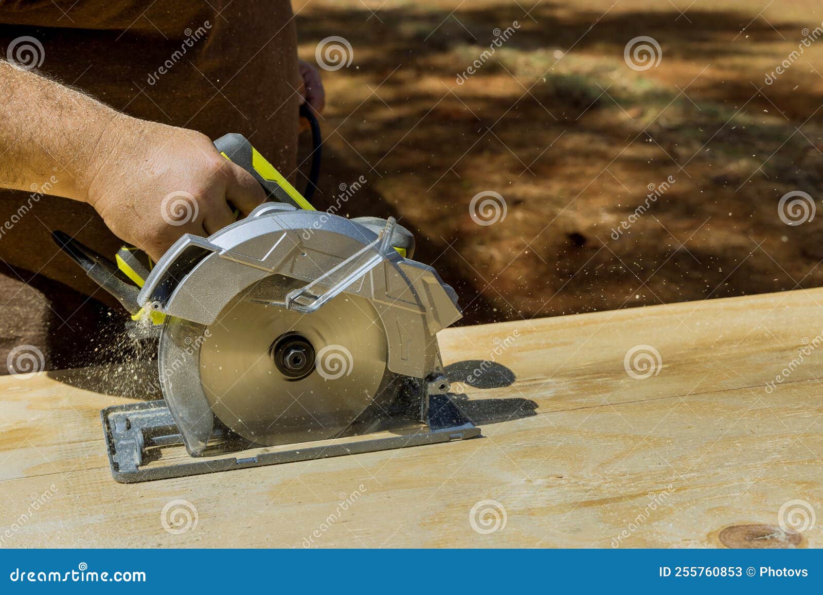 Cutting Plywood with a Circular Saw that is Held in the Hand by a ...