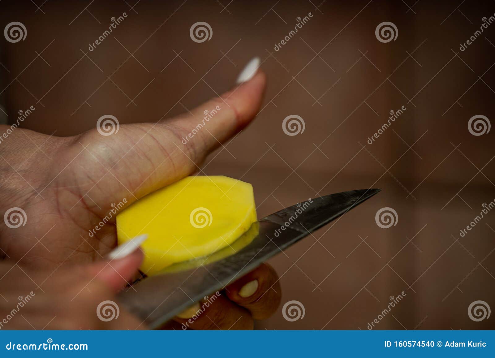 Cutting Potato in Women Hand with Knife Stock Photo - Image of potato ...