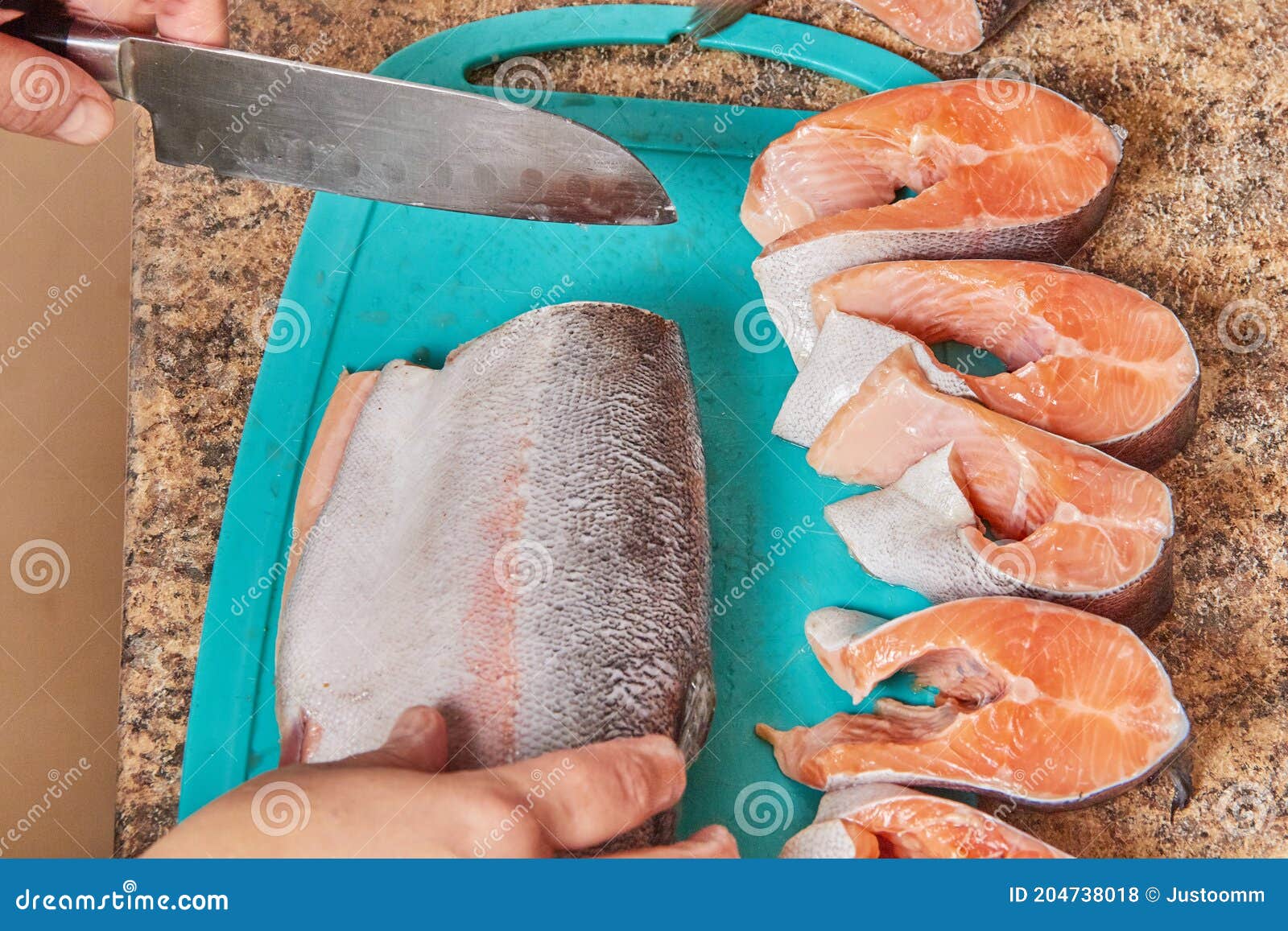 Cutting Red Fish into Pieces To Prepare the Dish Stock Photo - Image of ...
