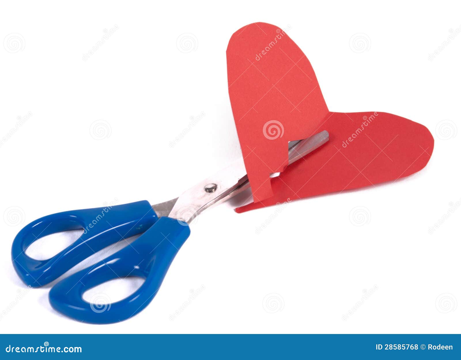 Cutting a red heart stock photo. Image of valentines - 28585768