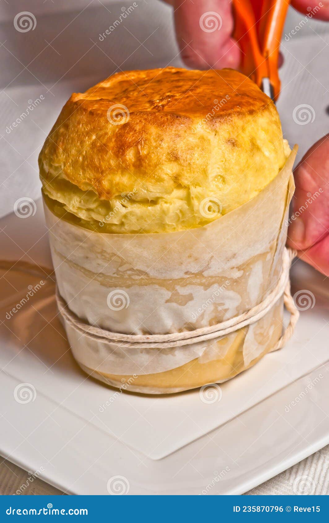 Cutting the String Holding Paper Collar of Cheese Stock Photo - Image ...