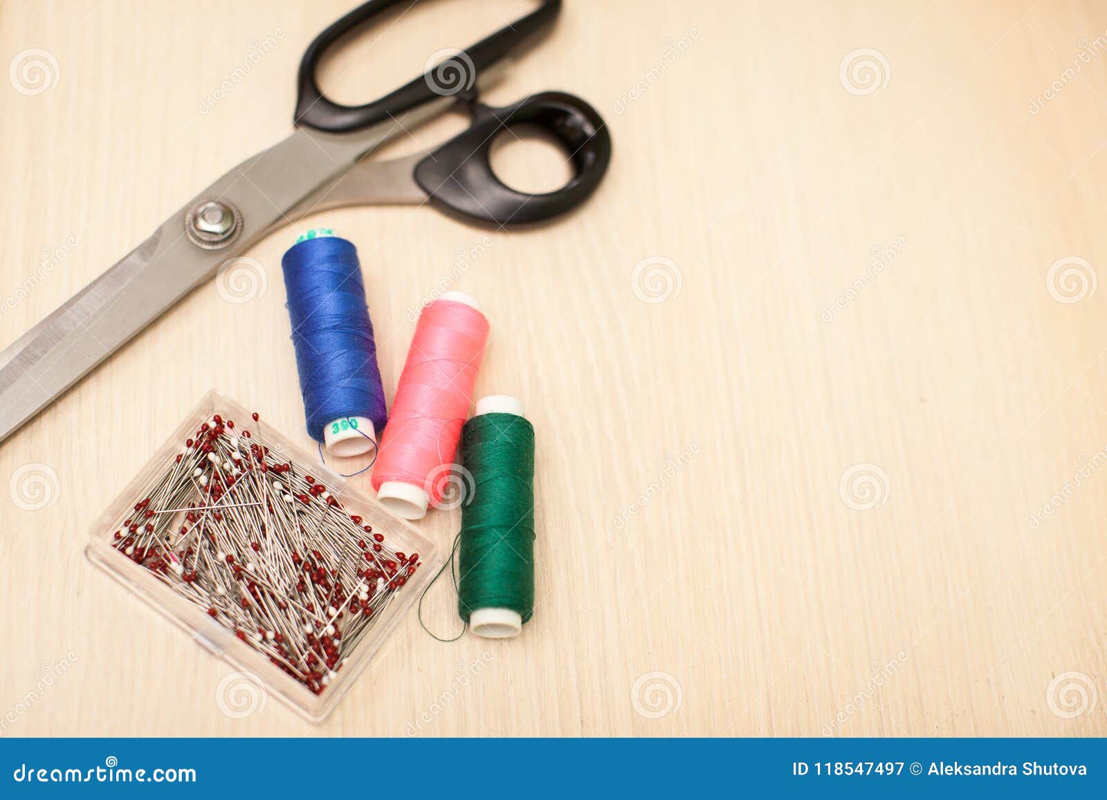 On the Cutting Table Lie Scissors, Thread and Pins. Work Place of ...