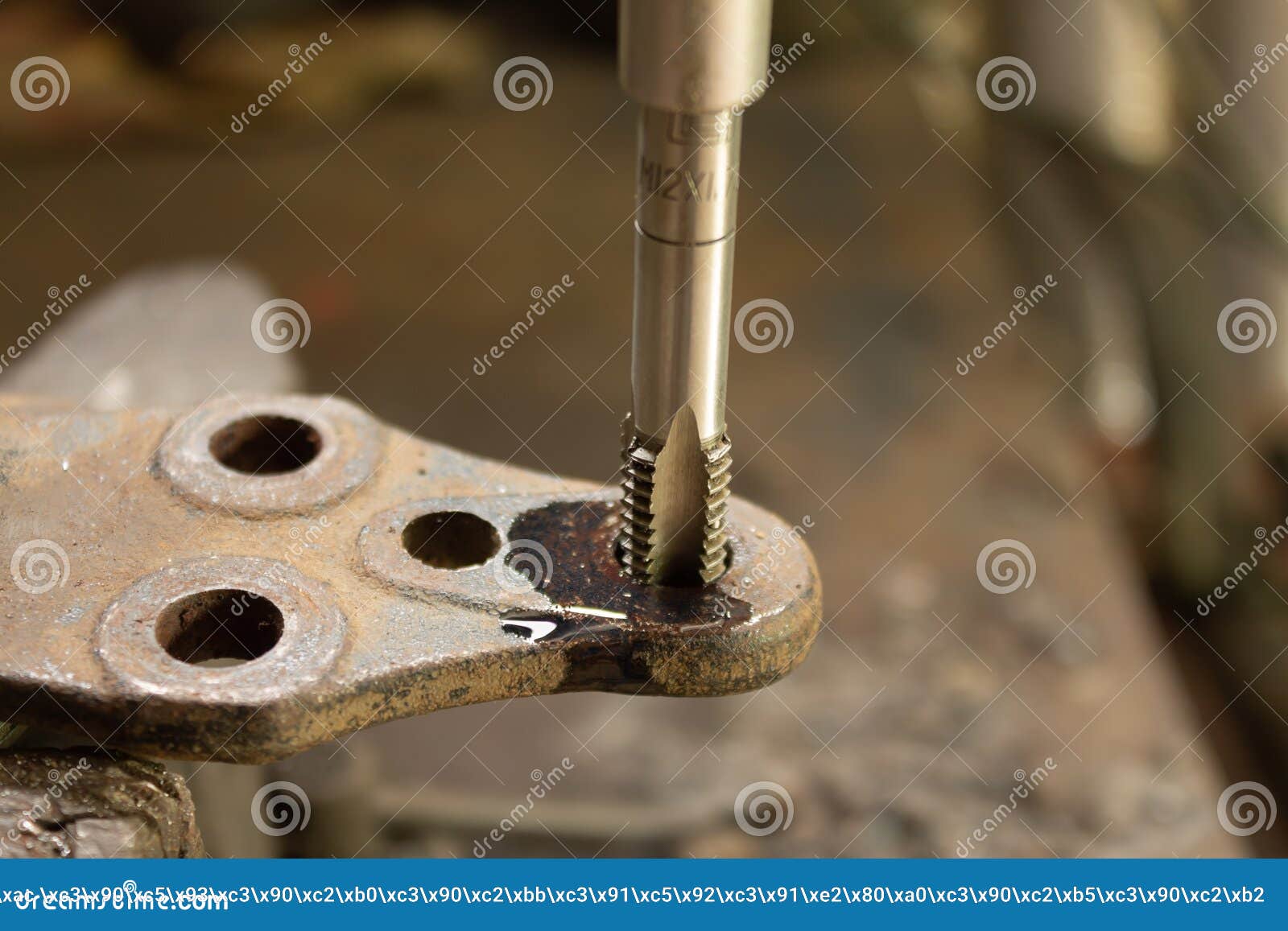 Cutting a Thread in a Hole with a Tap by Hand. Material High Speed ...