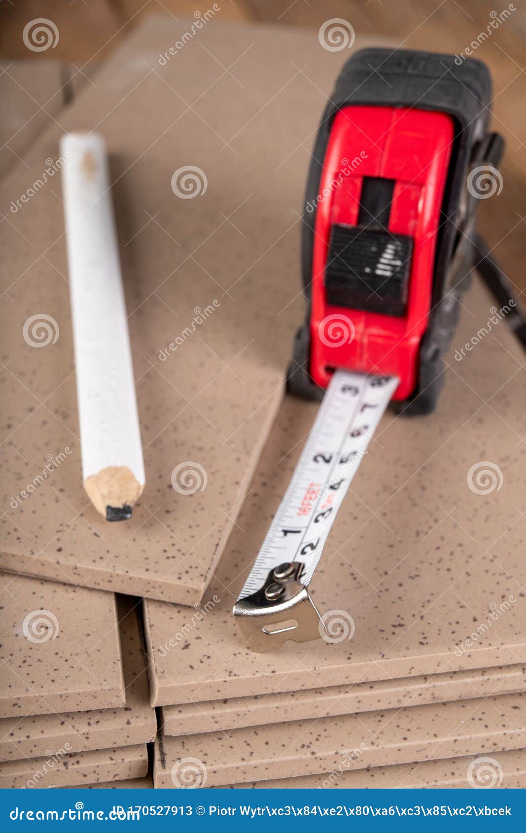 Cutting Tiles in a Home Workshop. Tiling Work on a Workshop Table Stock ...