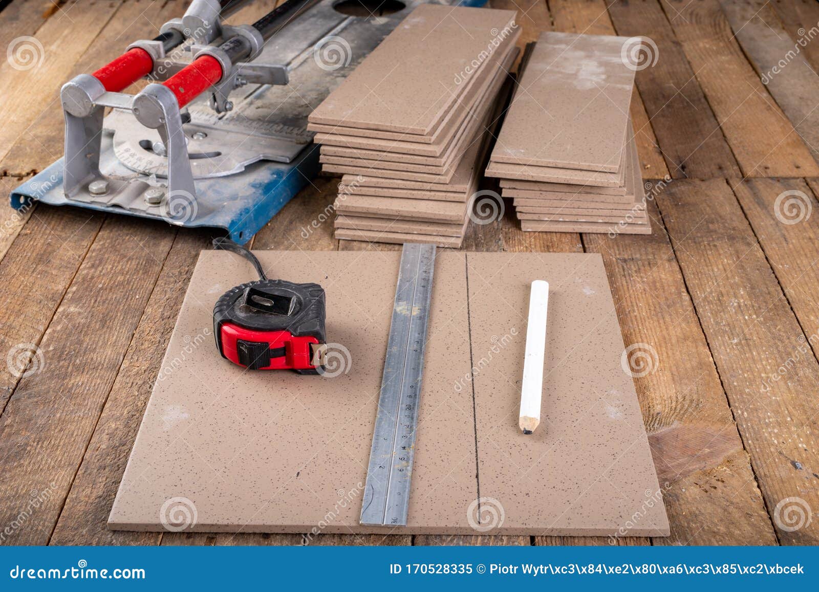 Cutting Tiles in a Home Workshop. Tiling Work on a Workshop Table Stock ...