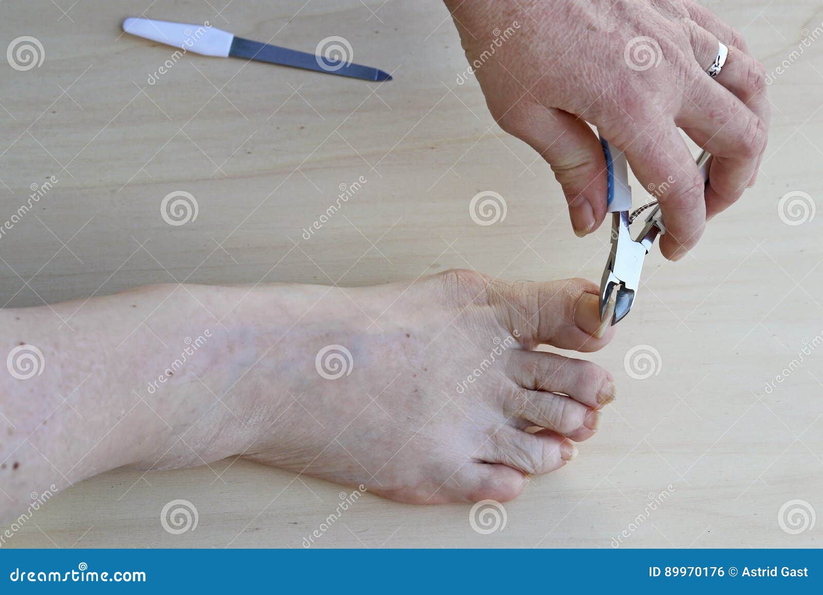 Cutting the toe nails stock photo. Image of hands, hygiene - 89970176