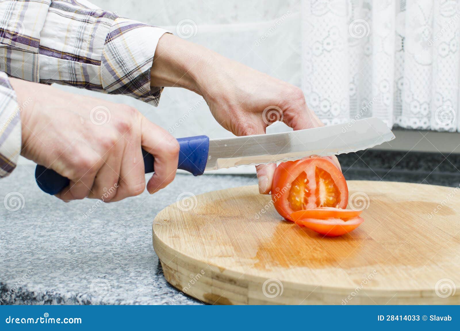 Cutting a tomato stock image. Image of arms, domestic - 28414033
