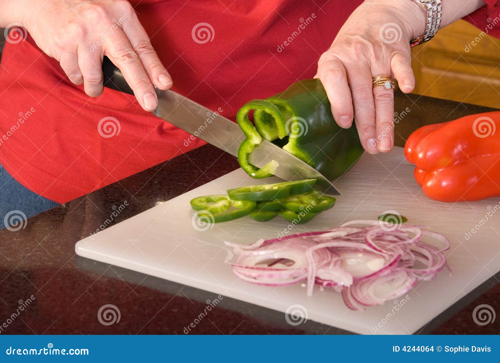 Cutting up vegetables. stock photo. Image of granite, hand - 4244064