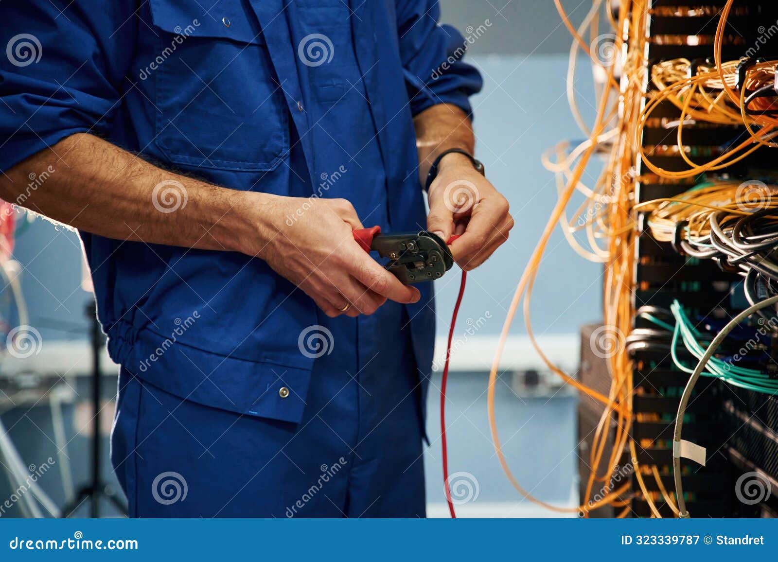 Cutting the Wire. Young Man is Working with Internet Equipment in ...