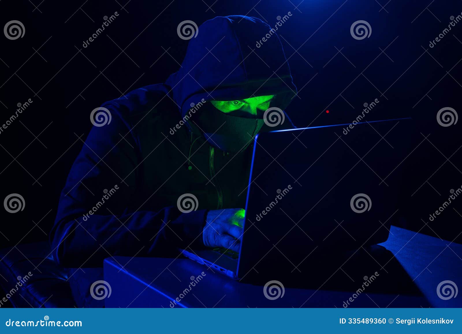 Cyber Hacker in Hood Behind Laptop in Dark Room, Digital Cyber Security ...