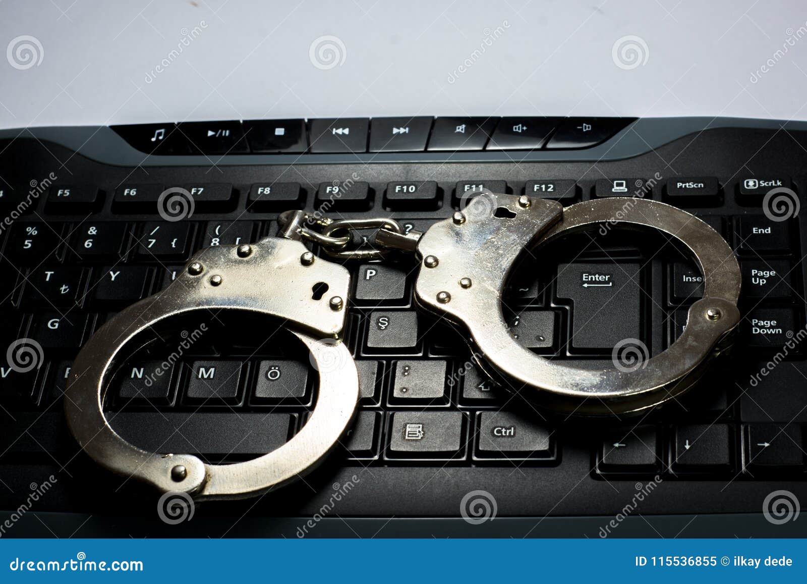 Handcuffs on keyboard stock image. Image of computer - 115536855