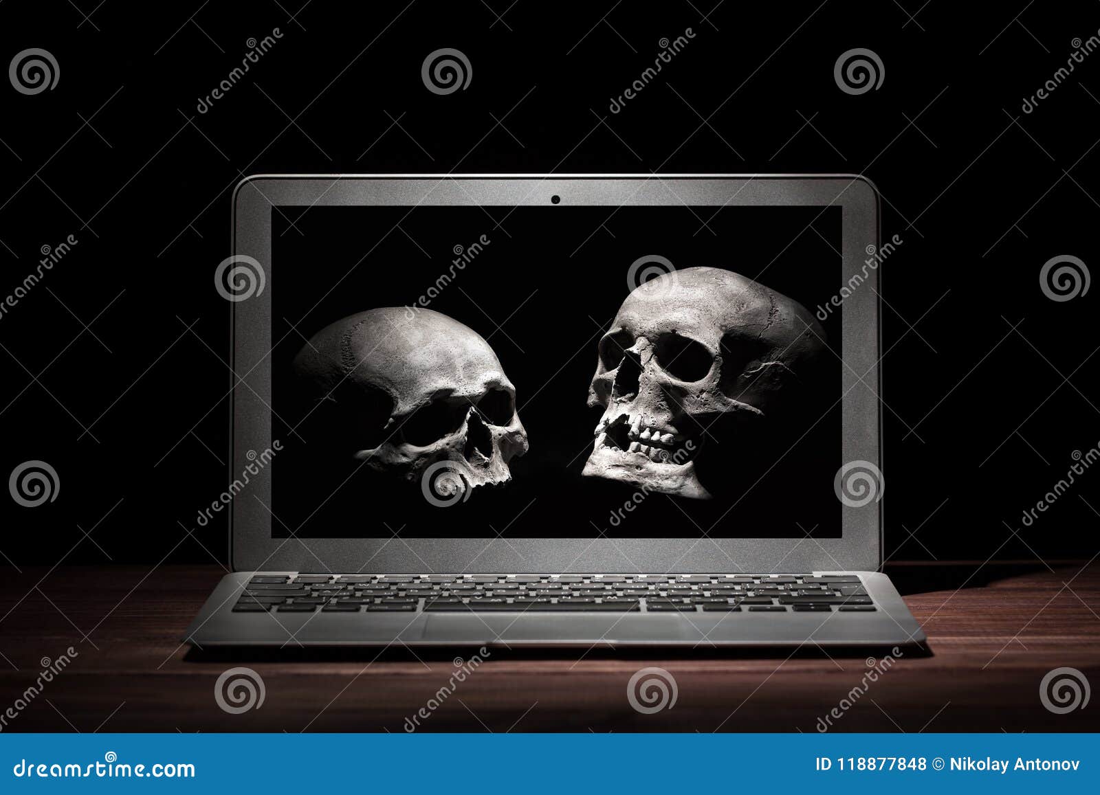 Cybercrime or Hacking Concept. Laptop in Dark Room Under Beam of Light ...