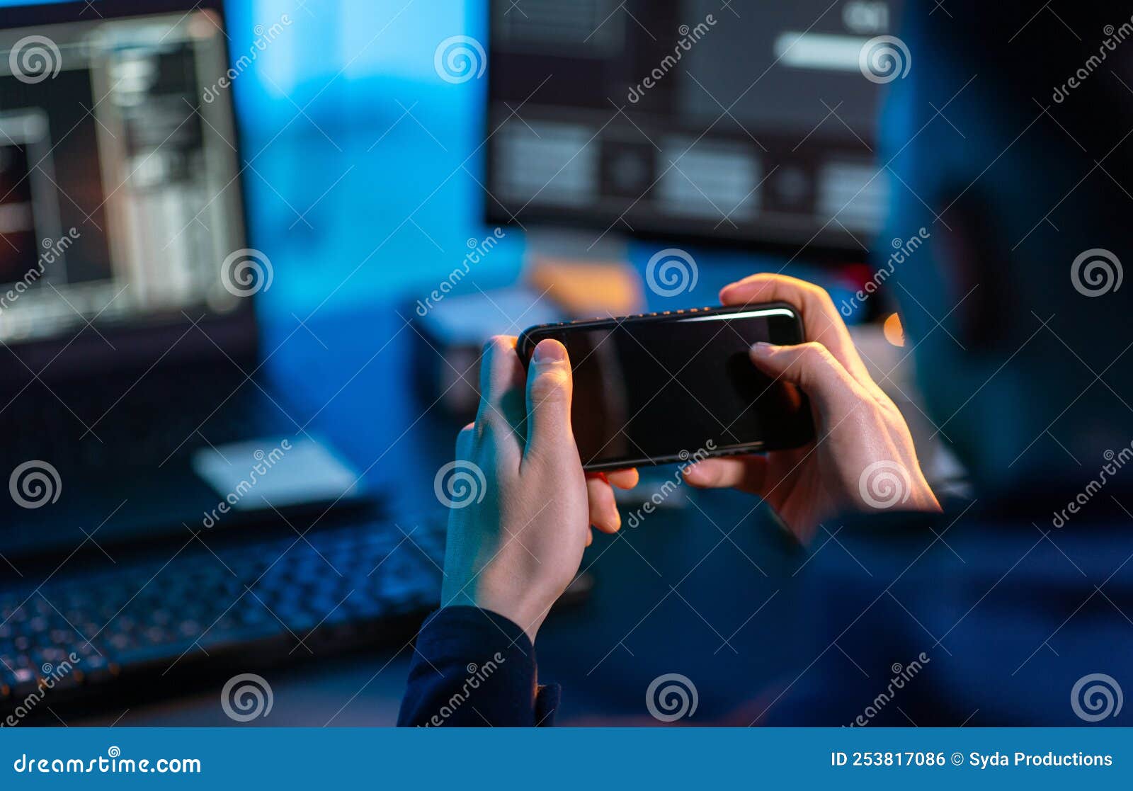 Hacker with Smartphone and Computers in Dark Room Stock Photo - Image ...