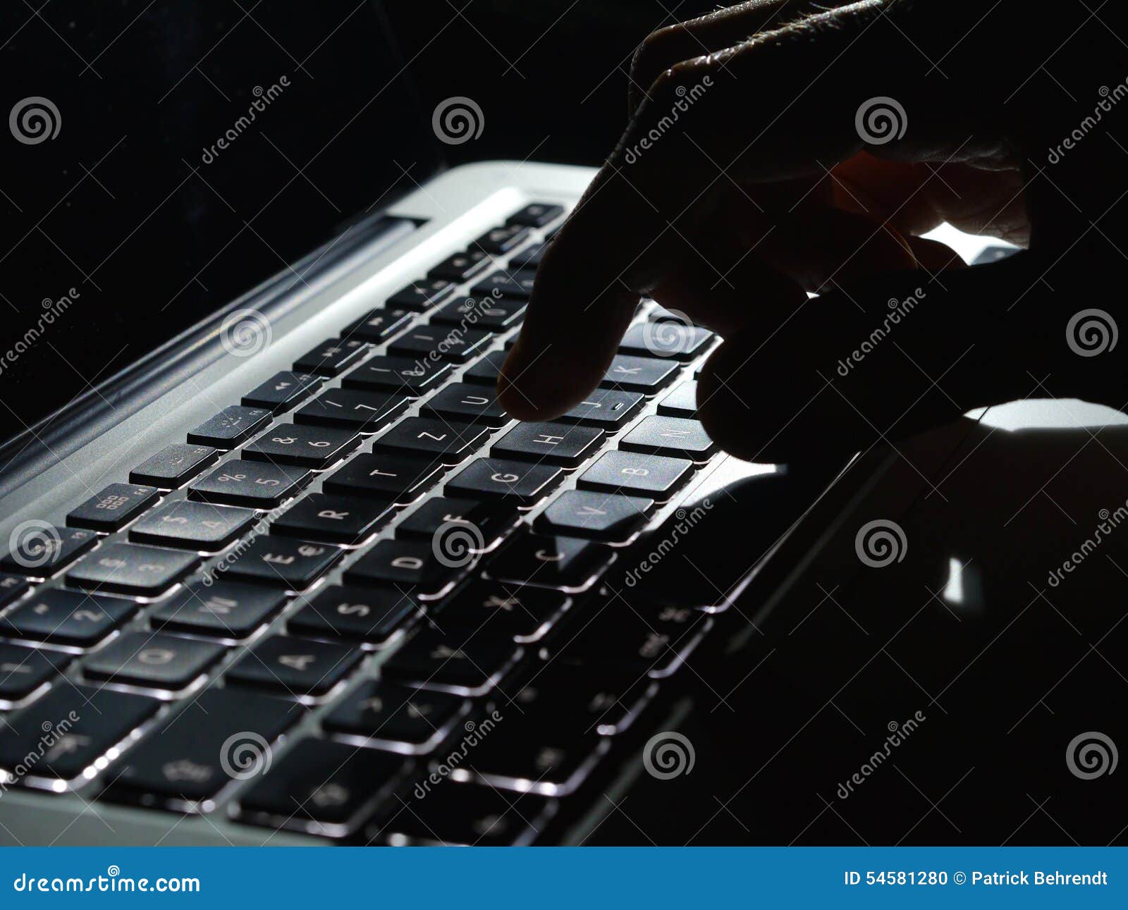 Cybercrime - One Hand on Lighted Keyboard Close Up Stock Photo - Image ...