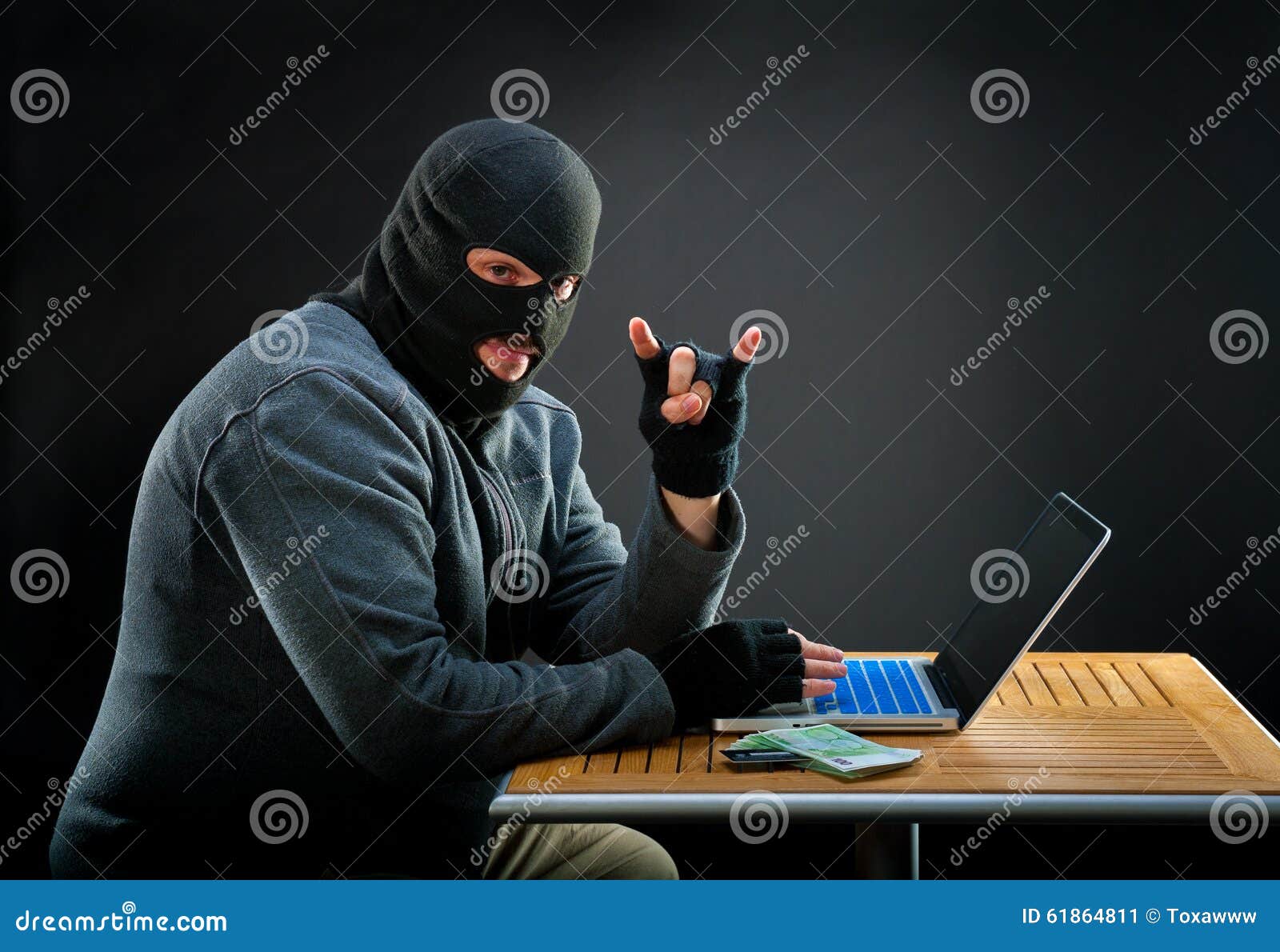 Cybercriminal man stock image. Image of laptop, black - 61864811