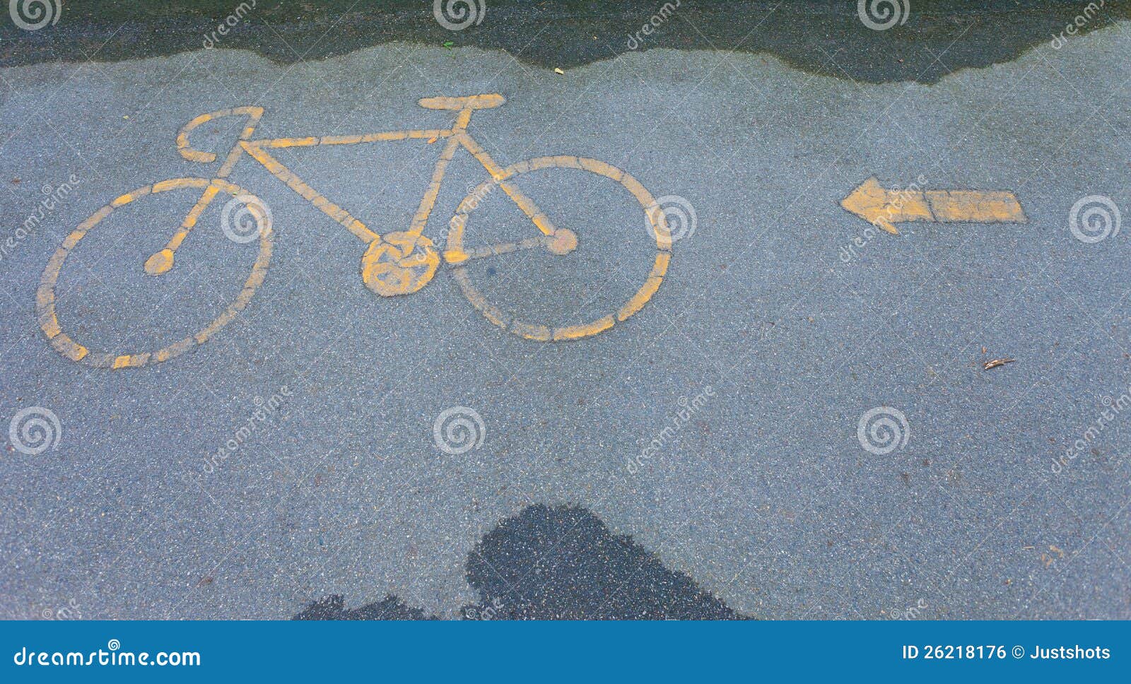 Yellow Cycle Lane With White Painted Bicycle Symbols. Low Angle ...