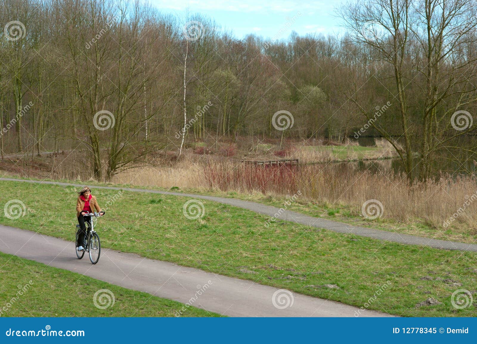 Cycling in a Park stock image. Image of enjoy, grass - 12778345