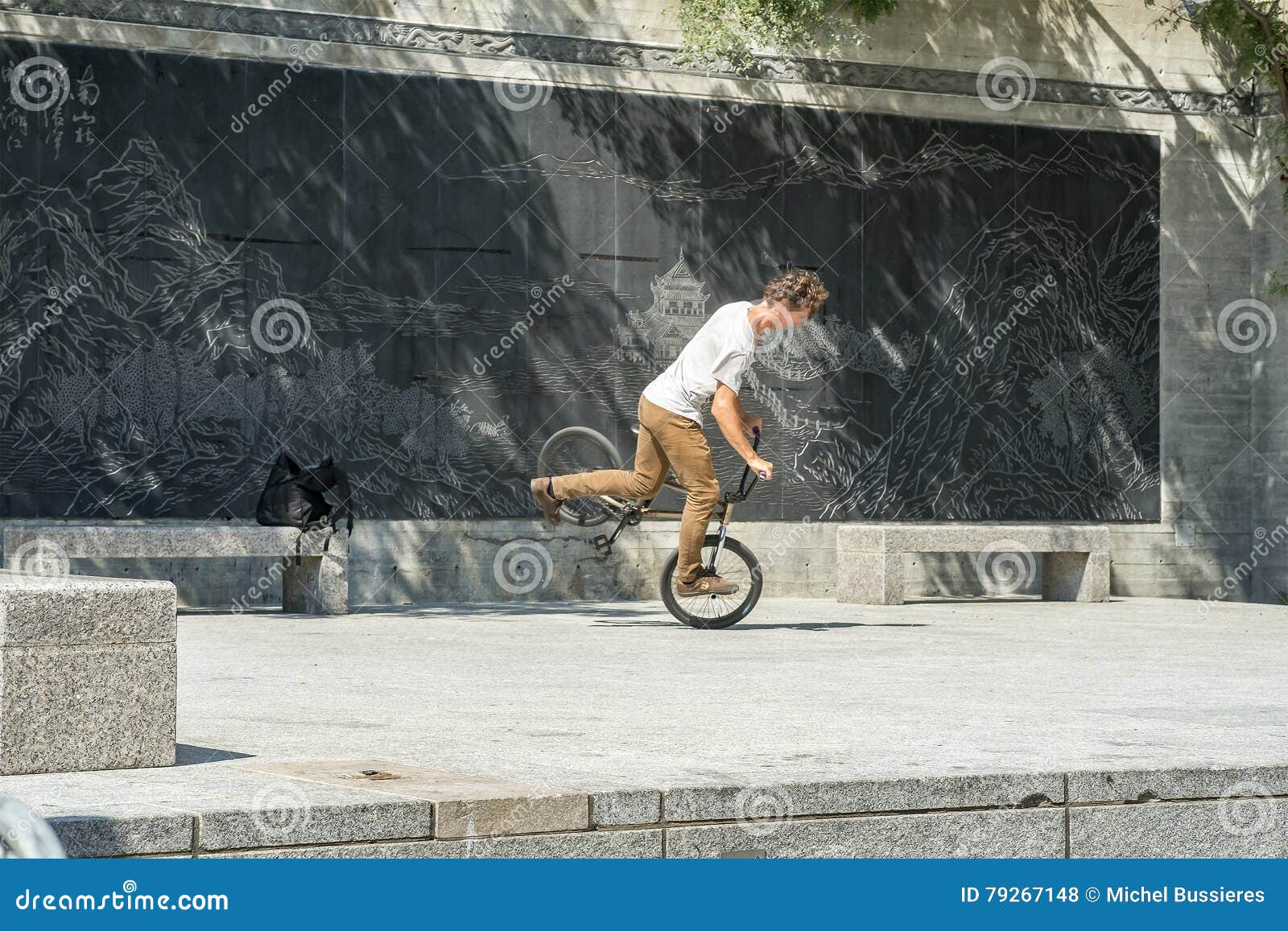 Cyclist acrobat editorial stock photo. Image of standing - 79267148