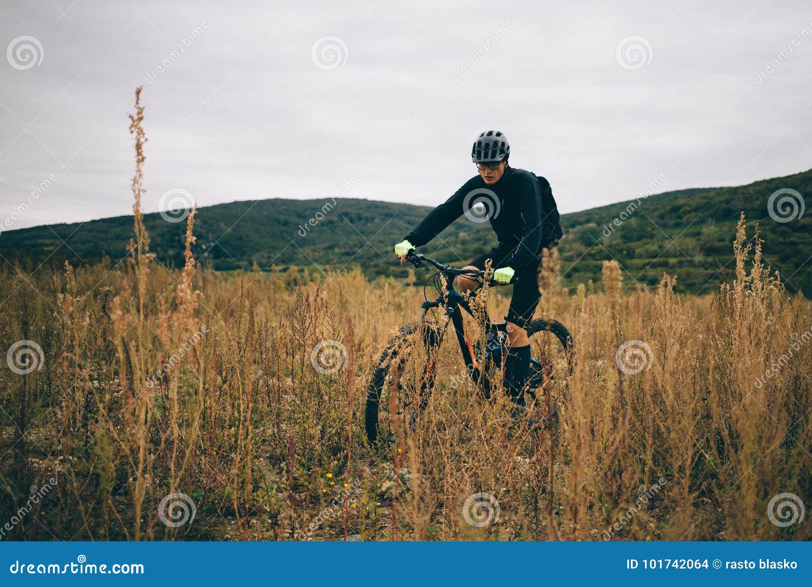 A cyclist in black stock photo. Image of road, path - 101742064