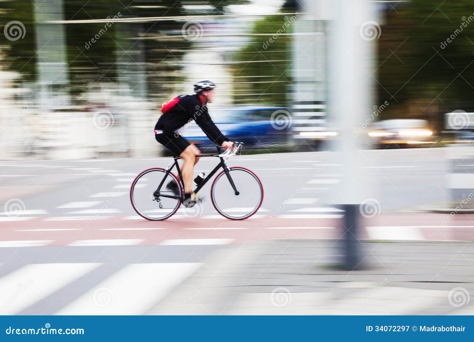 Cyclist in city traffic stock image. Image of moving - 34072297