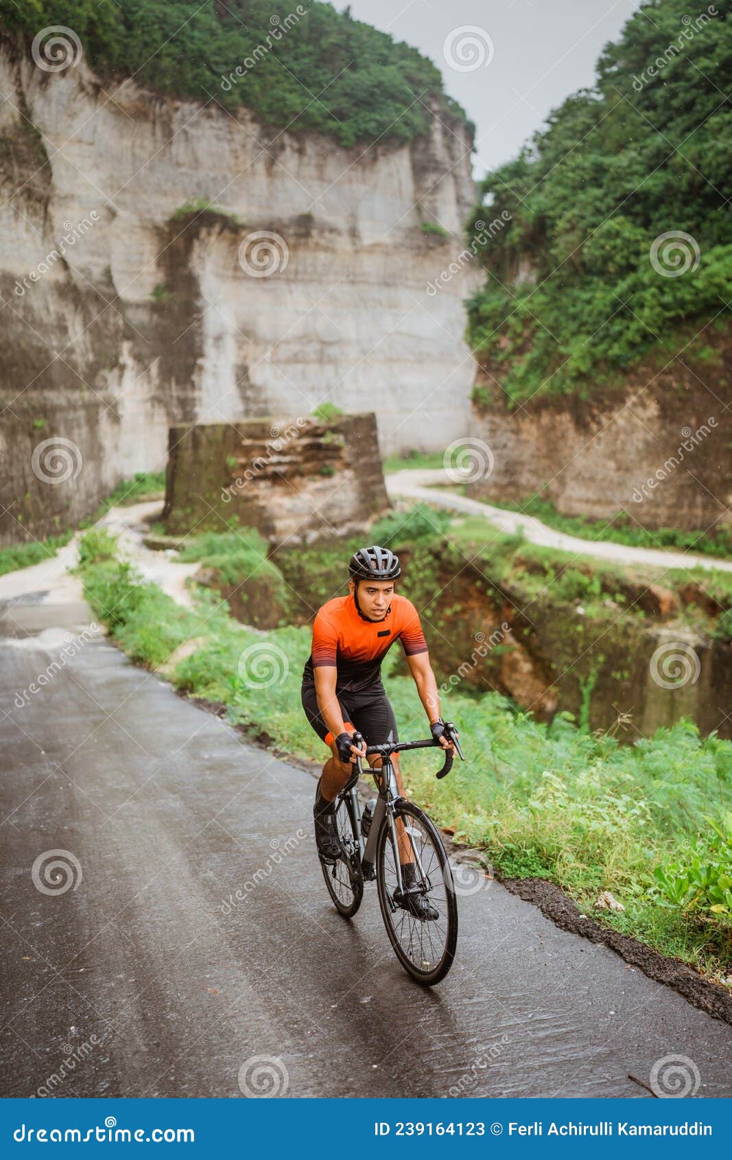 Cyclist Climbing Up Elevated Road Using His Road Bike Stock Image ...