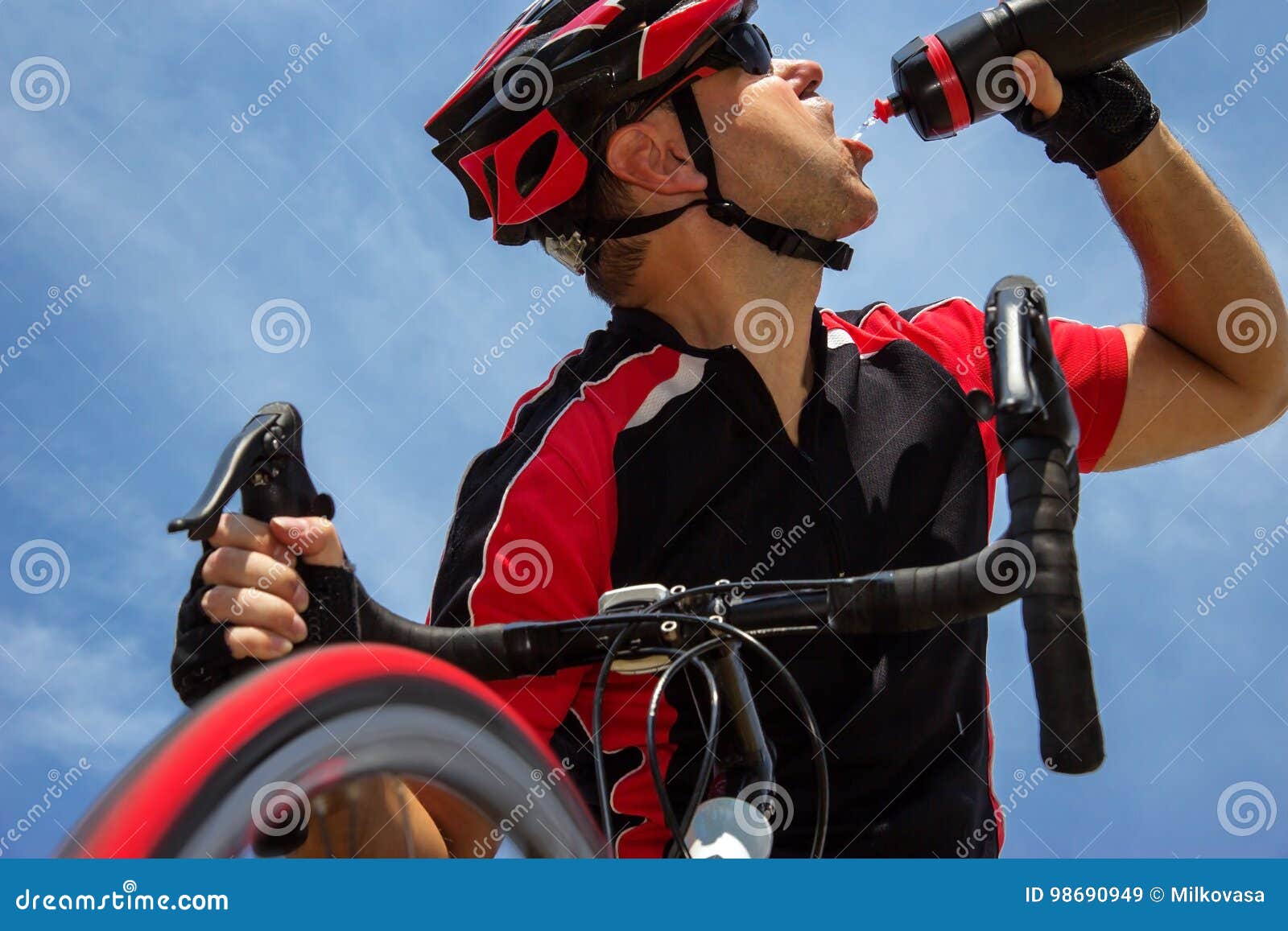 Cyclist Drinking from a Bottle Stock Image - Image of helmet, emotion ...