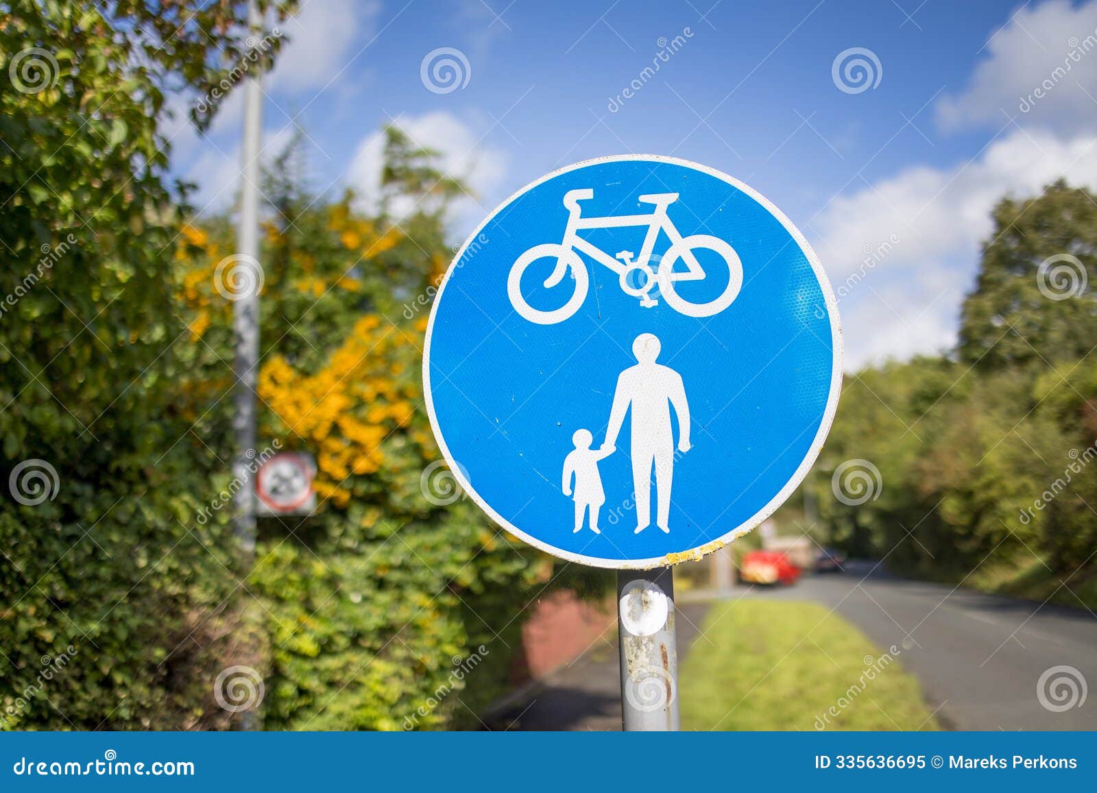 One Pedestrian In Blue Jeans Walks Along Tactile Paving For Visu ...