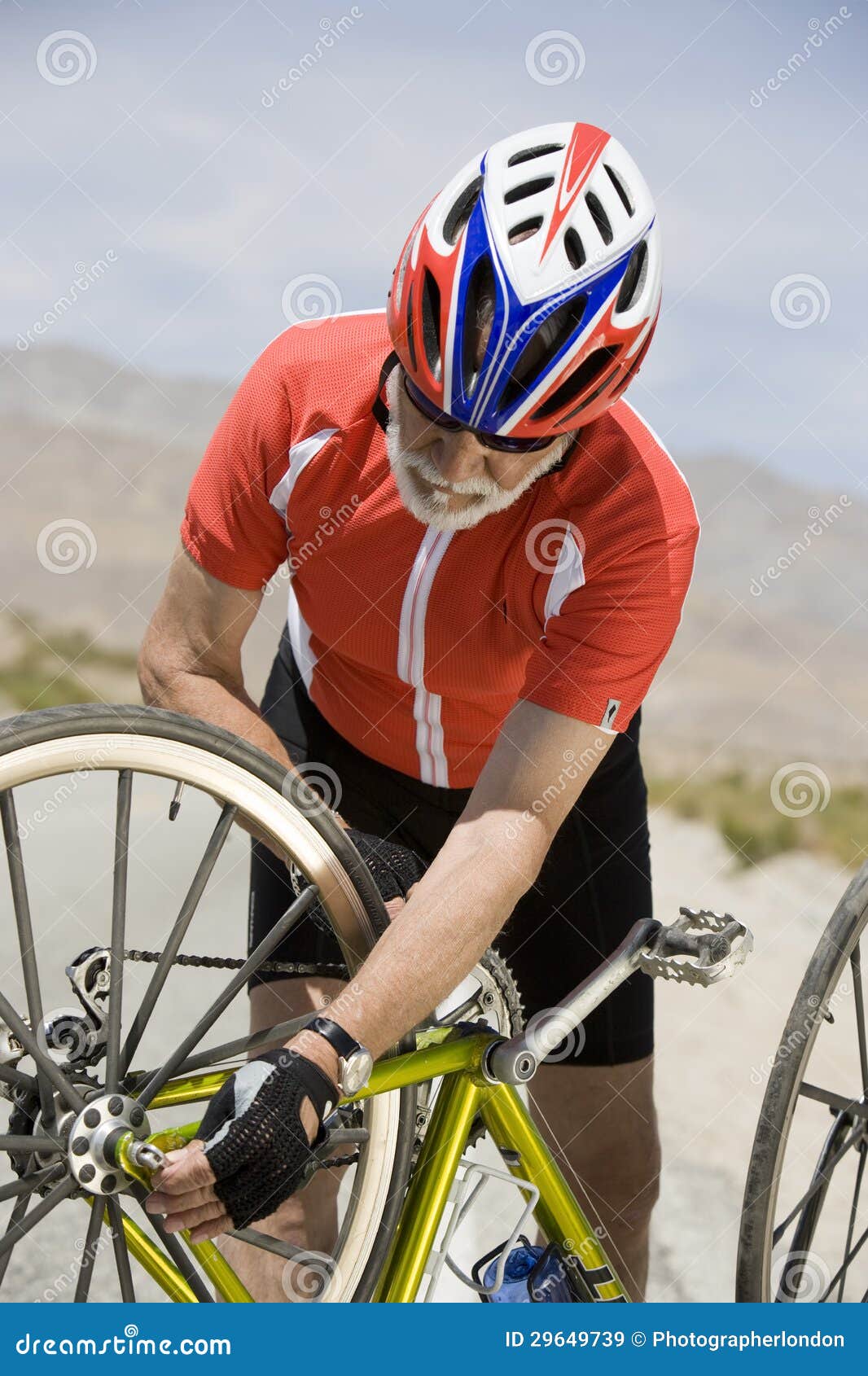 Cyclist Repairing Cycle stock image. Image of retirement - 29649739