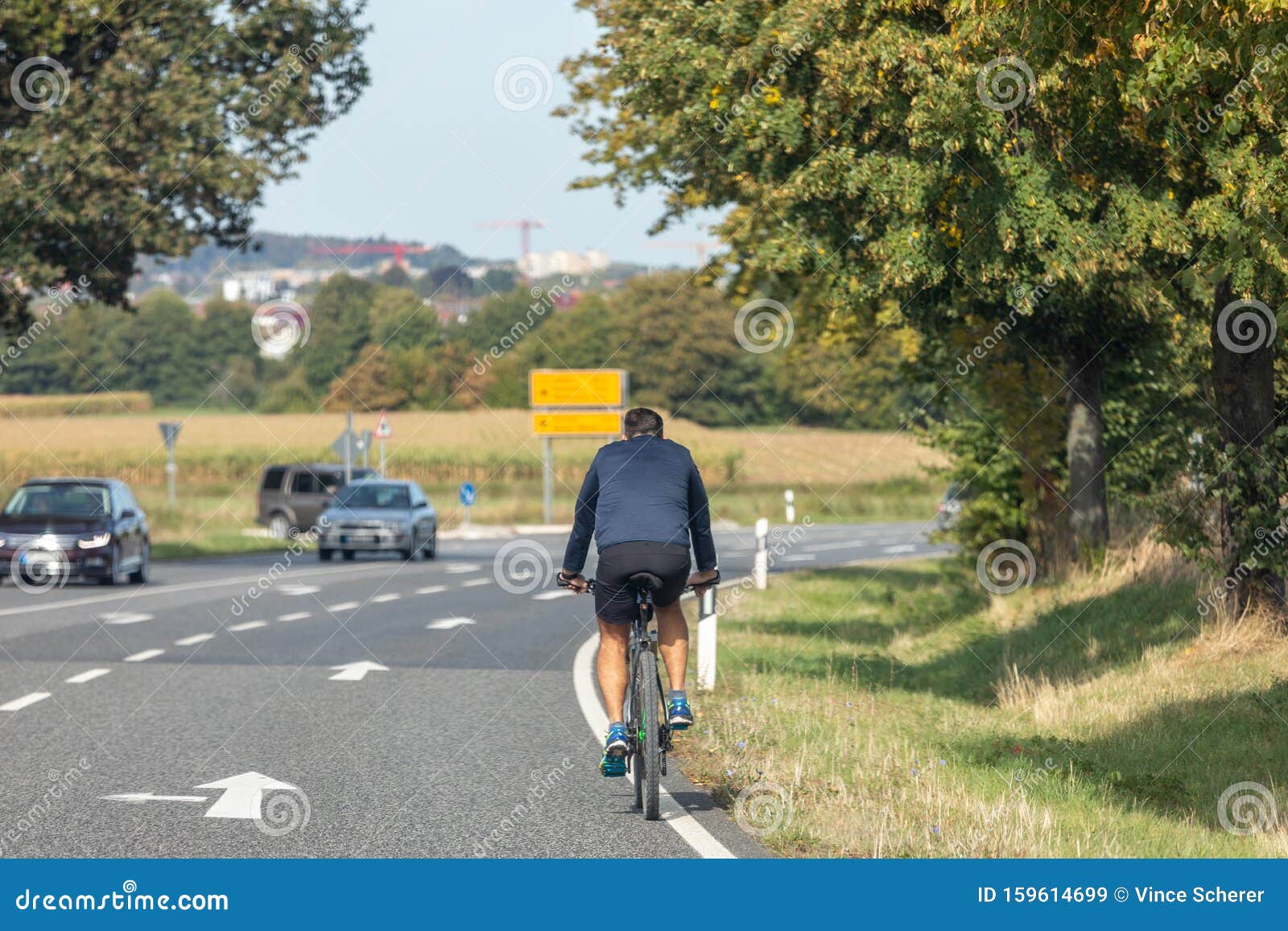 Cyclist Rides on the Highway on a Bicycle Stock Image - Image of ...