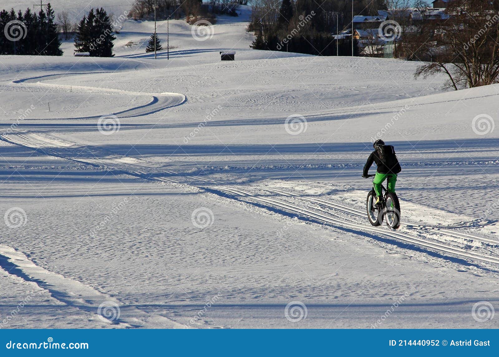 A Cyclist Rides through the Snow in Winter Stock Photo - Image of ride ...