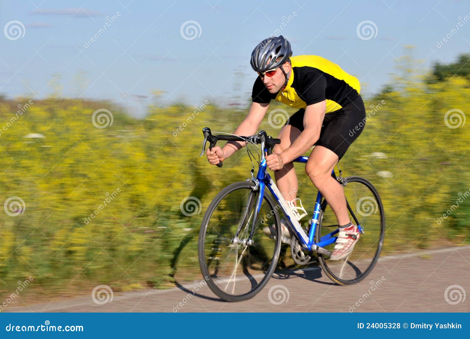 Cyclist riding a bicycle stock photo. Image of competitive - 24005328