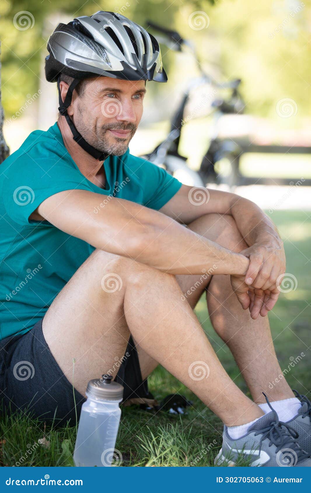 Cyclist Sits on Grass in Nature Stock Image - Image of recreation ...