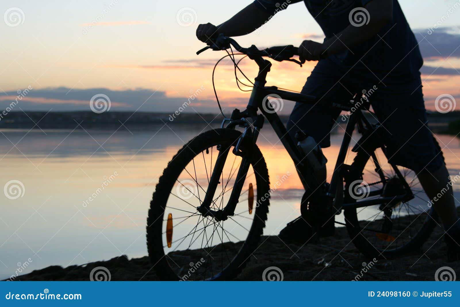 Cyclist at sunset stock photo. Image of field, lifestyle - 24098160