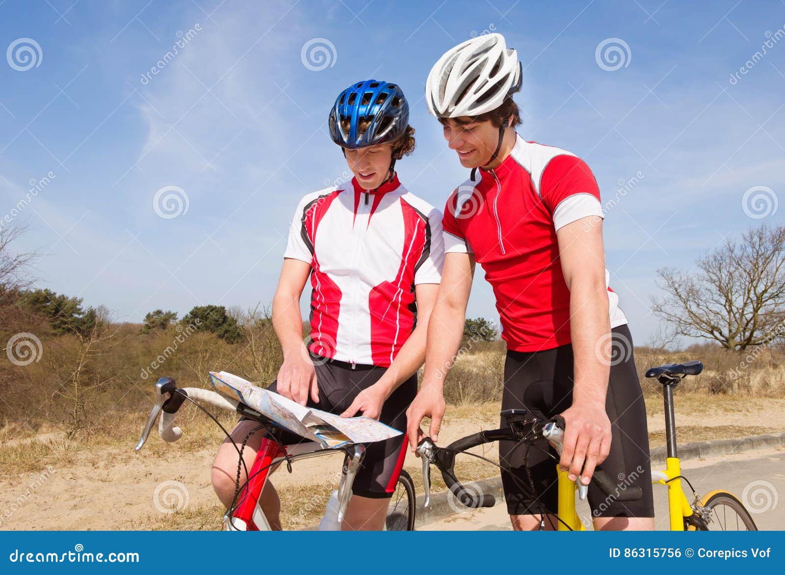 Cyclists looking at a map stock photo. Image of choice - 86315756