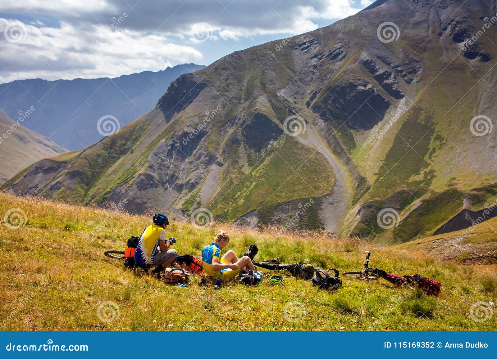 Cyclists Rest in the Mountains while Biking Stock Photo - Image of ...