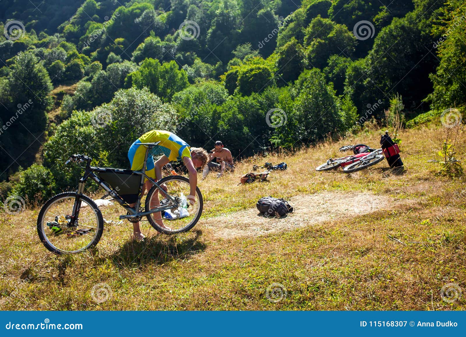 Cyclists Rest in the Mountains while Biking Stock Image - Image of ...