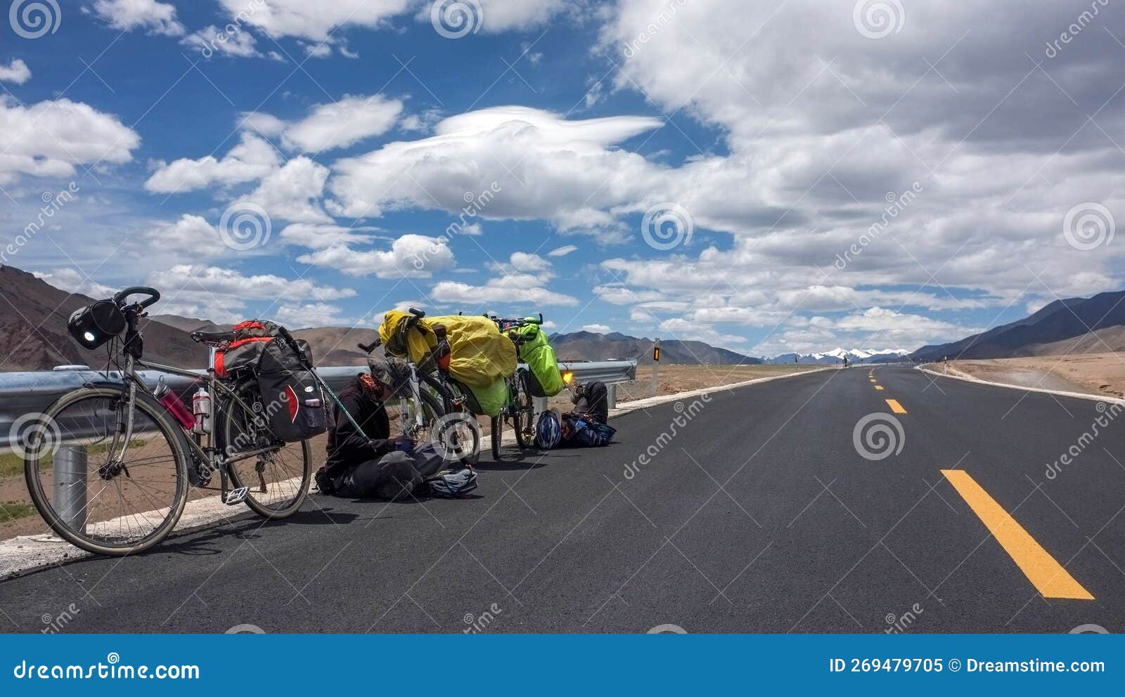 Cyclists Resting on the Side of the Road Stock Image - Image of ...