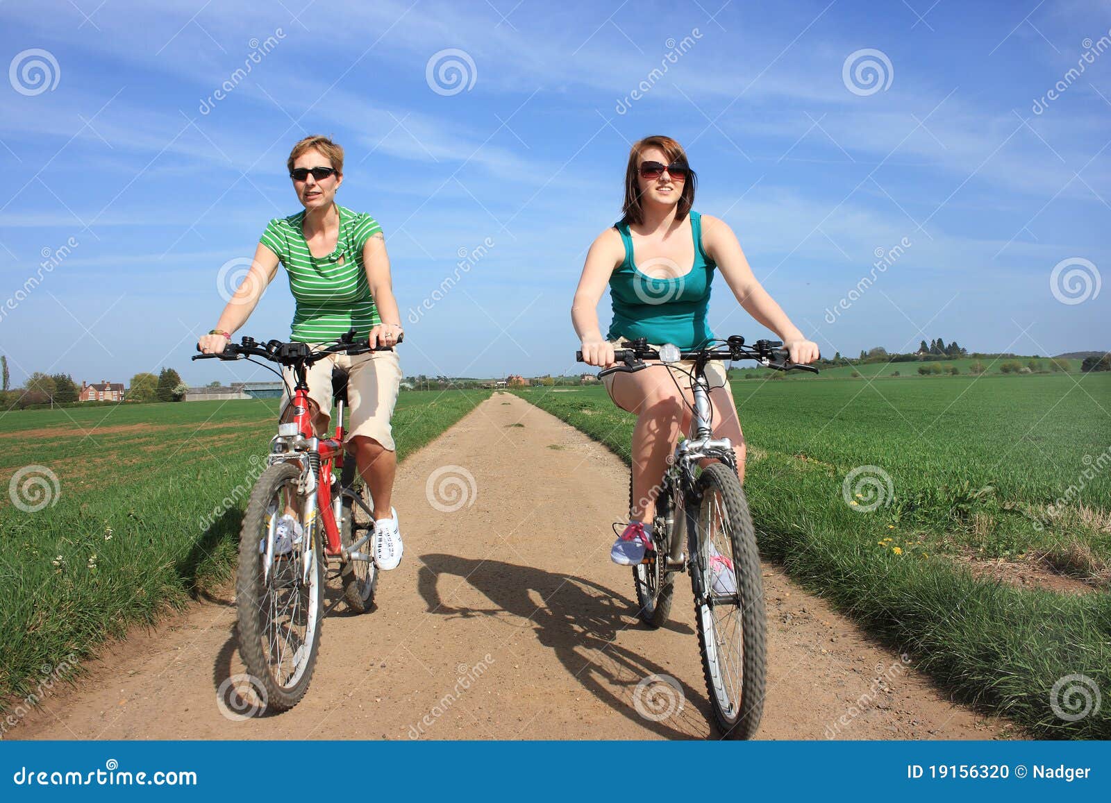 Cyclists side-by-side stock photo. Image of attractive - 19156320