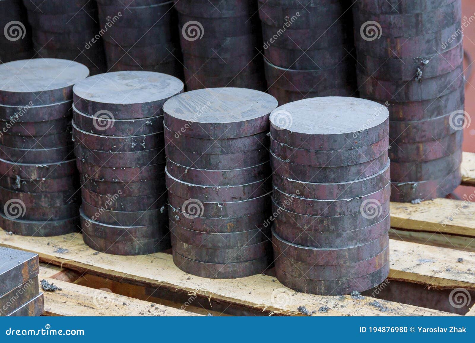 A Cylindrical Ingot of Raw Material is Cut into Pieces for Processing ...