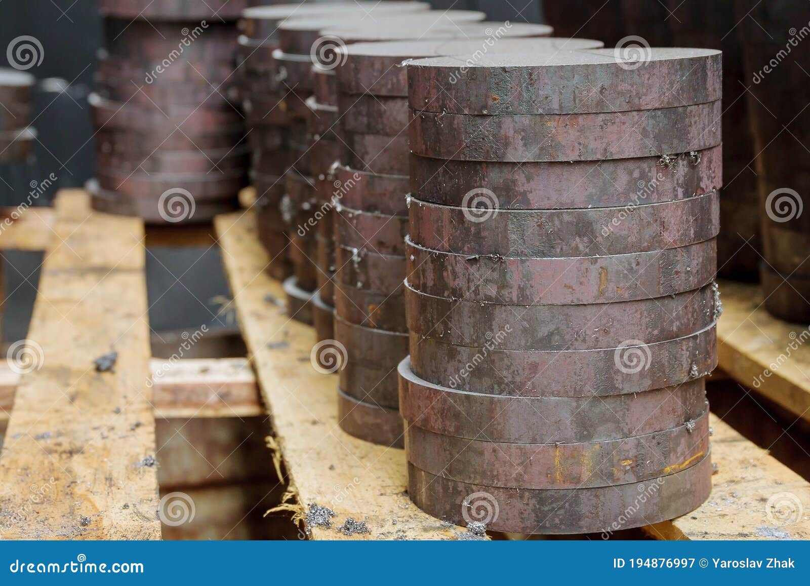 A Cylindrical Ingot of Raw Material is Cut into Pieces for Processing ...