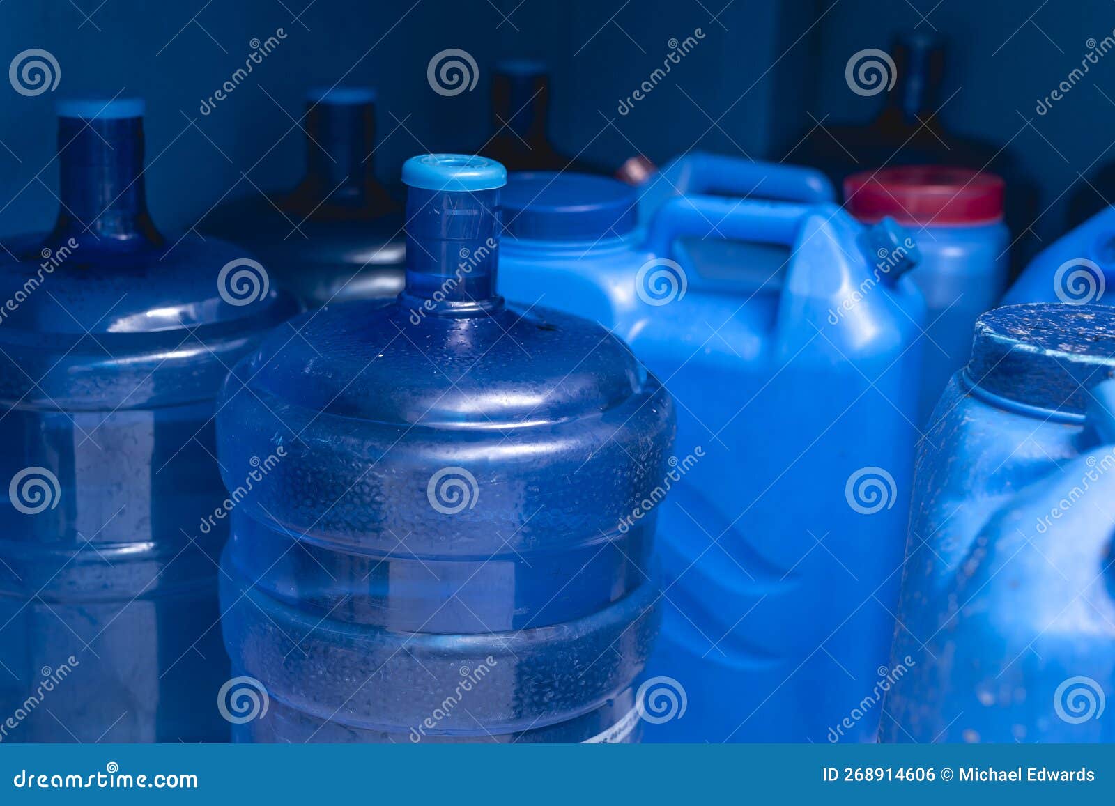 Cylindrical and Opaque Box Type HPDE Water Containers at a Refilling ...