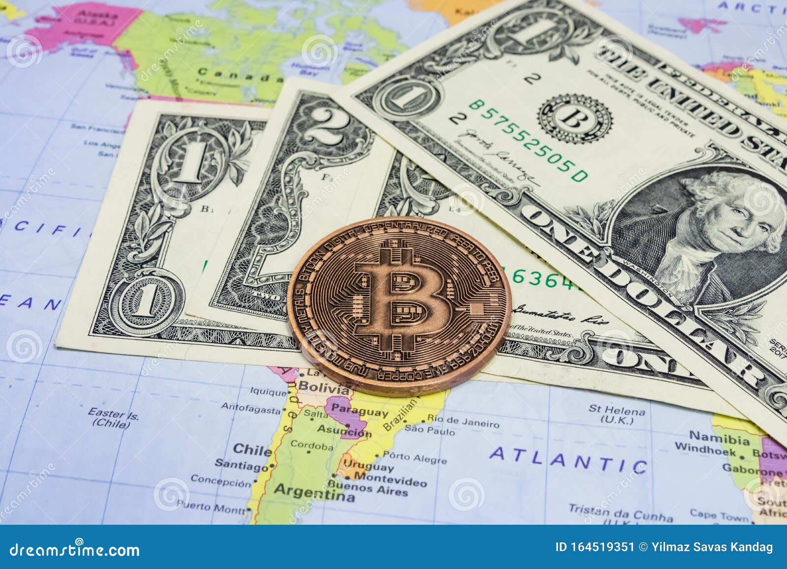 Close Up Physical Bitcoin Coin with US Dollars and World Map. Stock ...