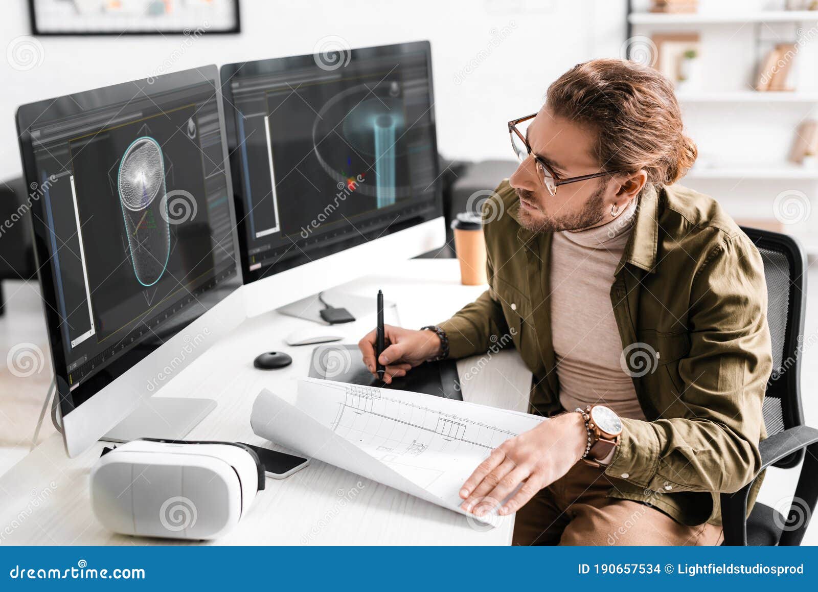 3d Artist Using Blueprint with Graphics Tablet and Computers while ...