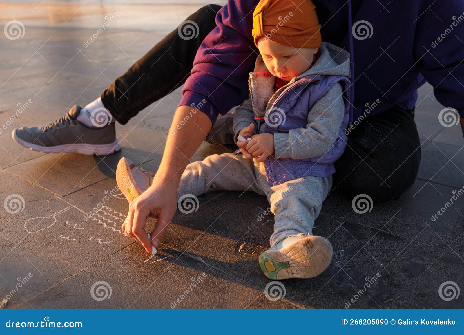 Dad and Child Draw with Chalk on the Pavement. Stock Photo - Image of ...