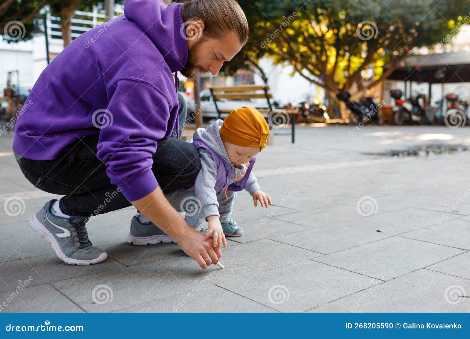 Dad and Child Draw with Chalk on the Pavement. Stock Photo - Image of ...