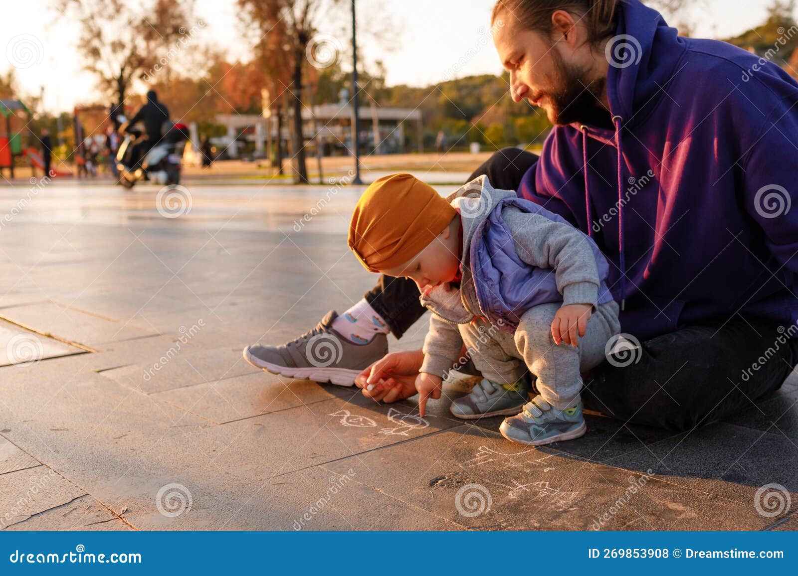Dad and Child Draw with Chalk on the Pavement. Stock Photo - Image of ...