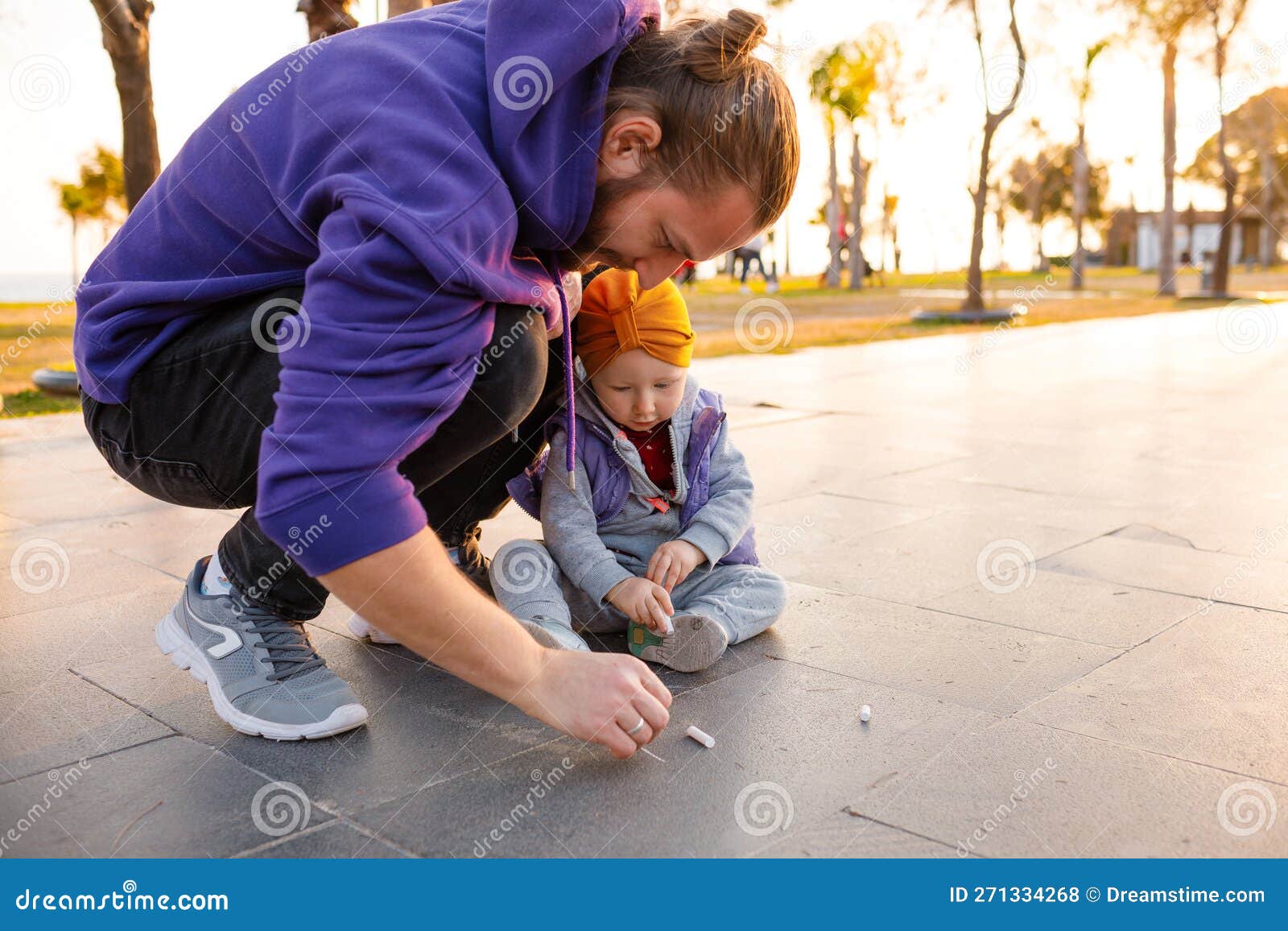 Dad and Child Draw with Chalk on the Pavement. Stock Photo - Image of ...