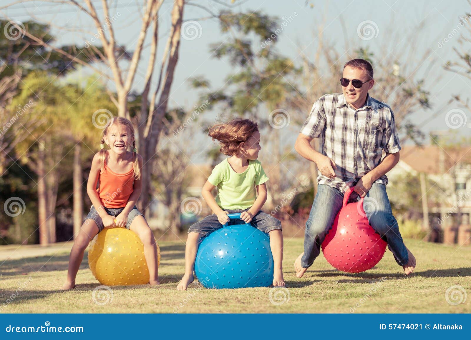 Dad and Children Playing on the Lawn in Front of House Stock Image ...