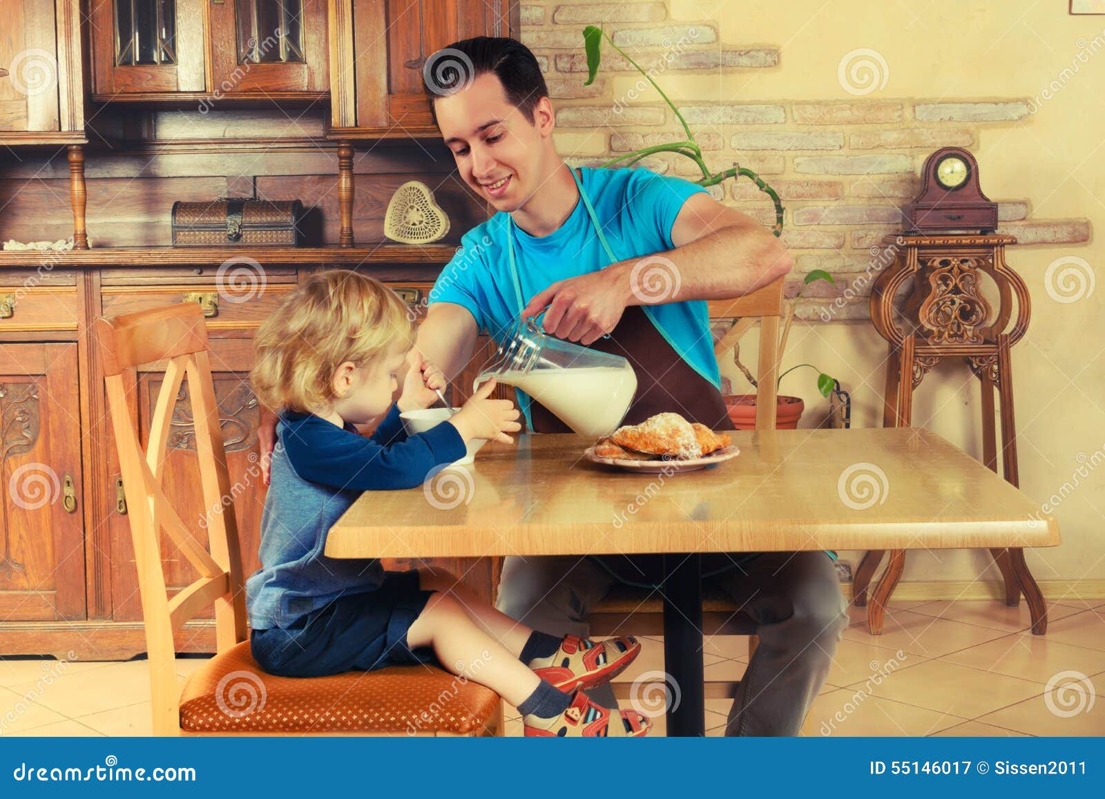 Dad cooks a breakfast stock image. Image of happiness - 55146017