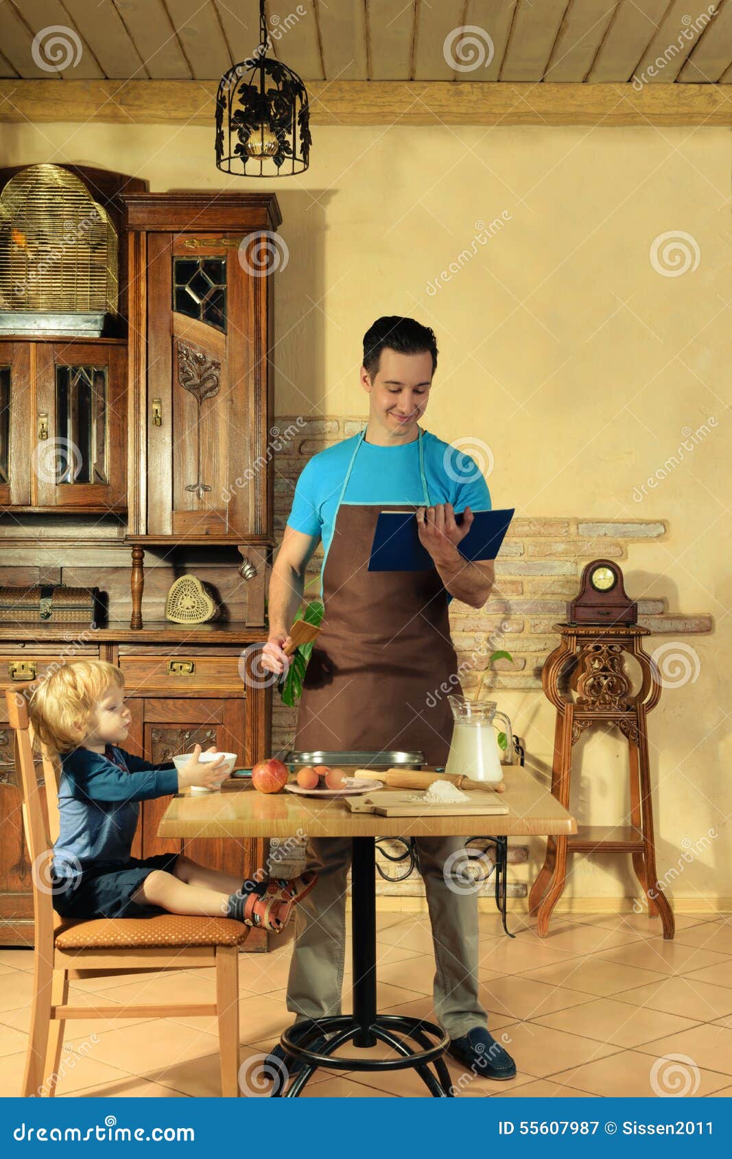 Dad cooks a breakfast stock image. Image of home, cooking - 55607987